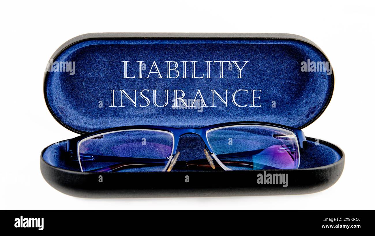 Text Liability Insurance on an open case with eyeglasses Stock Photo ...