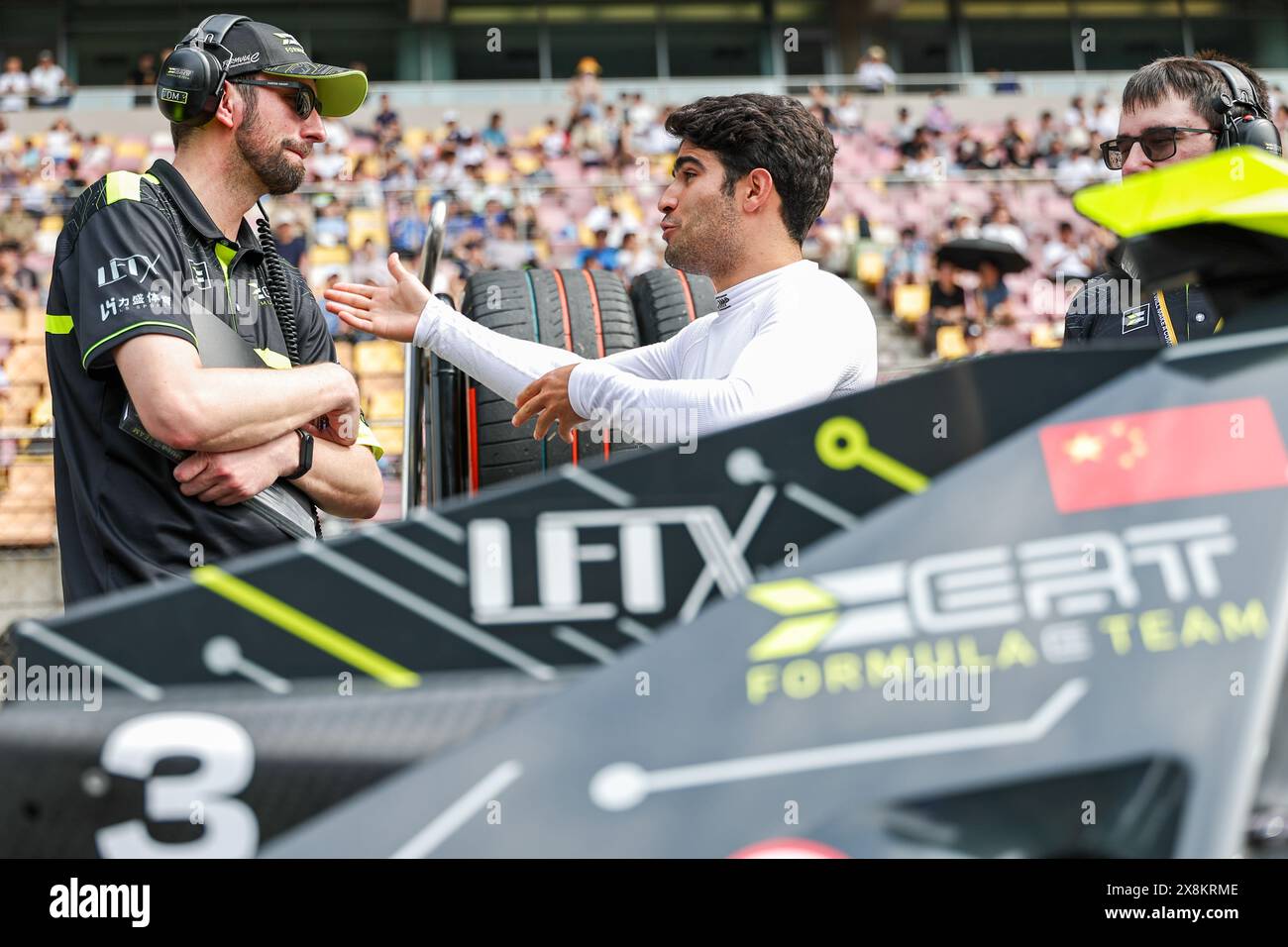 Shanghai. 26th May, 2024. Brazilian driver Sergio Sette Camara (C) of ...