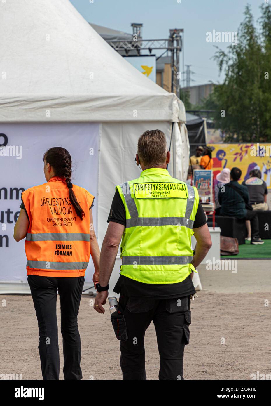 Security stewards patrolling the World Village Festival in May 2024 ...