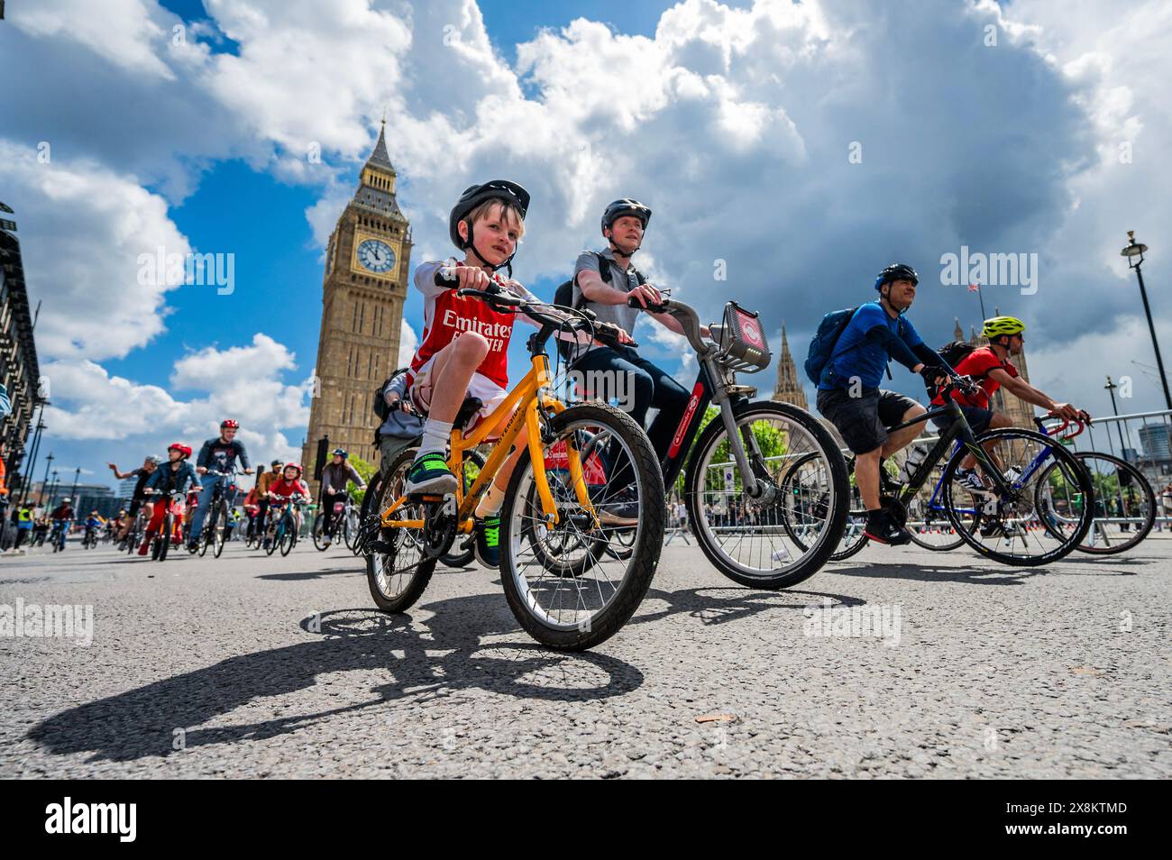 London, UK. 26th May, 2024. Riders of all ages passing the Houses of ...