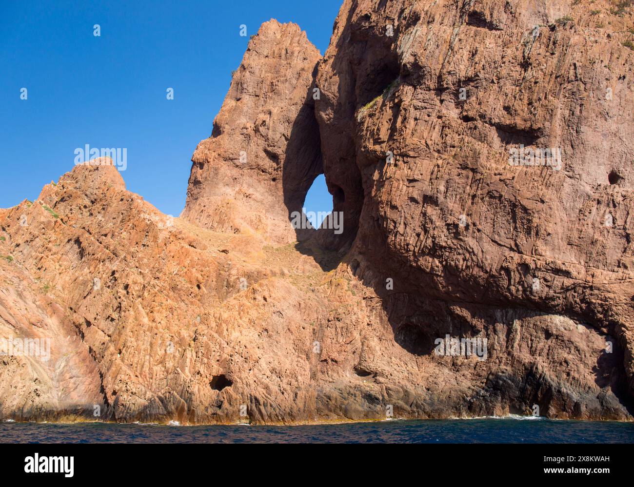 Girolata, Corse-du-Sud, Corsica, France. The rugged red cliffs of Punta ...