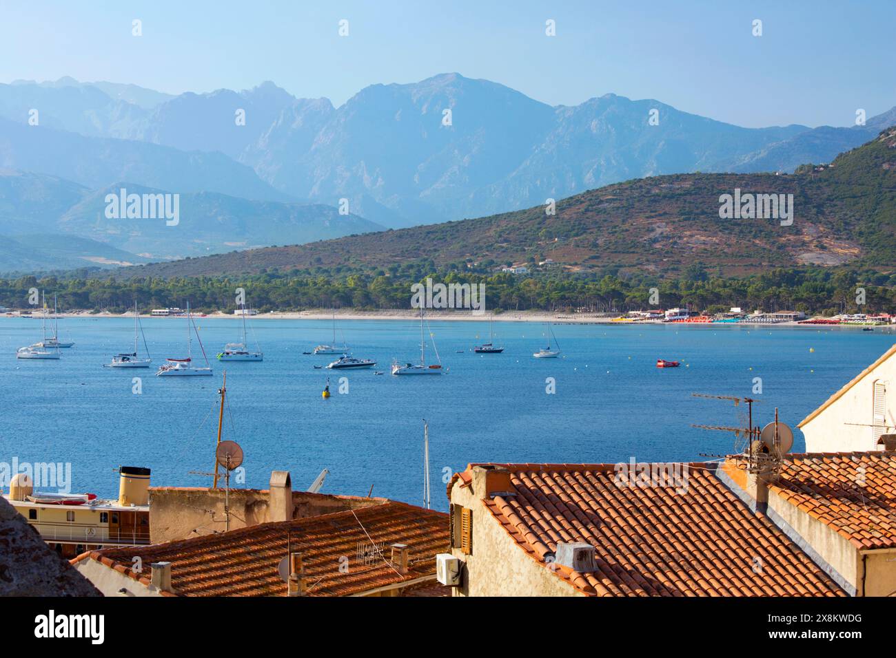 Calvi, Haute-Corse, Corsica, France. View over tiled rooftops to the ...
