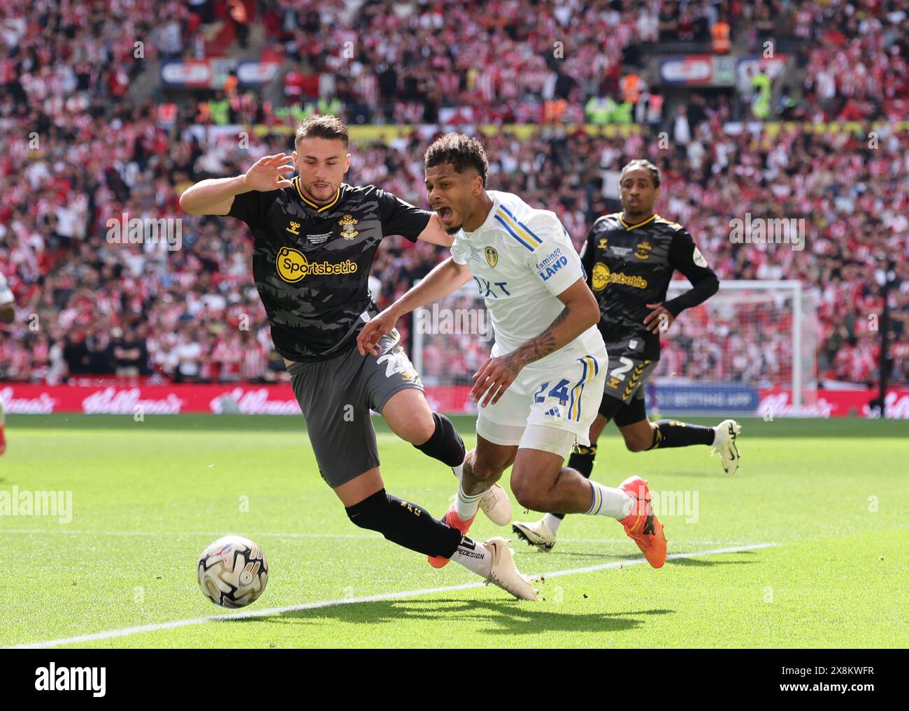 London, UK. 26th May, 2024. Georginio Rutter of Leeds United fouled by ...
