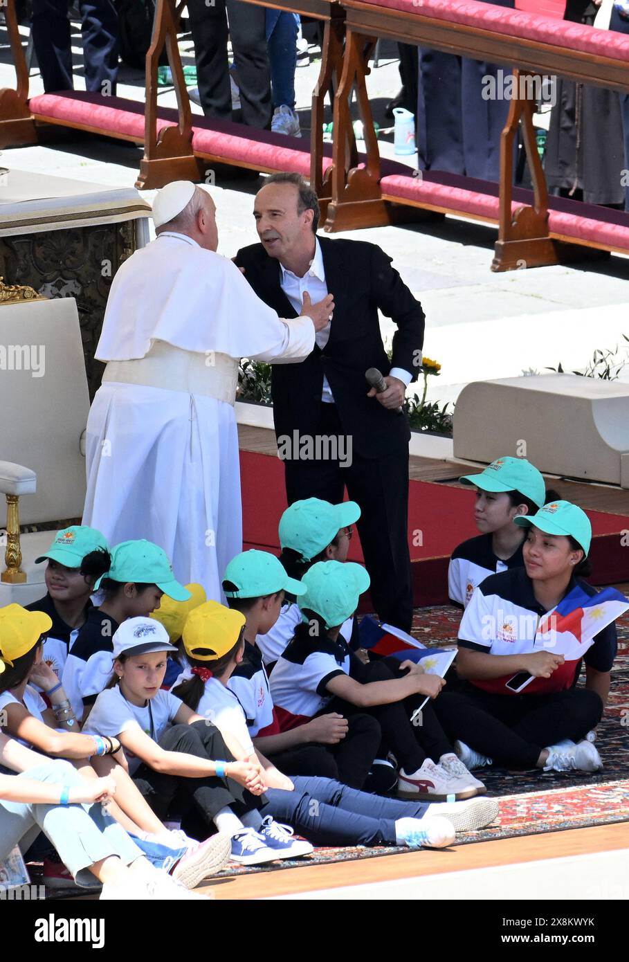 Pope Francis greets Italian film director Roberto Benigni (left) during ...