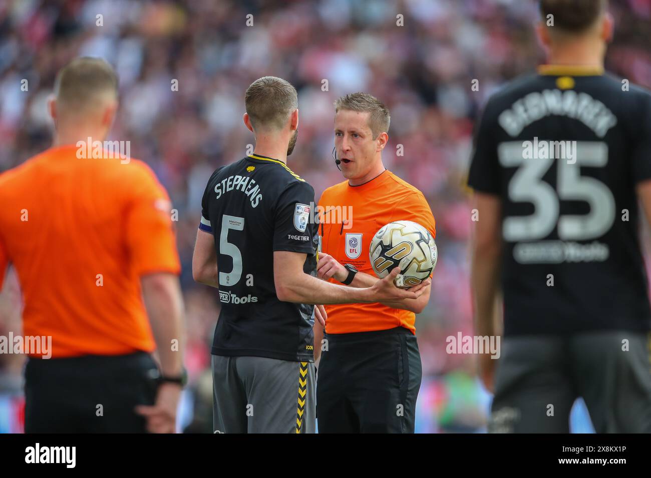 Referee John Brooks speaks to Jack Stephens of Southampton during the ...