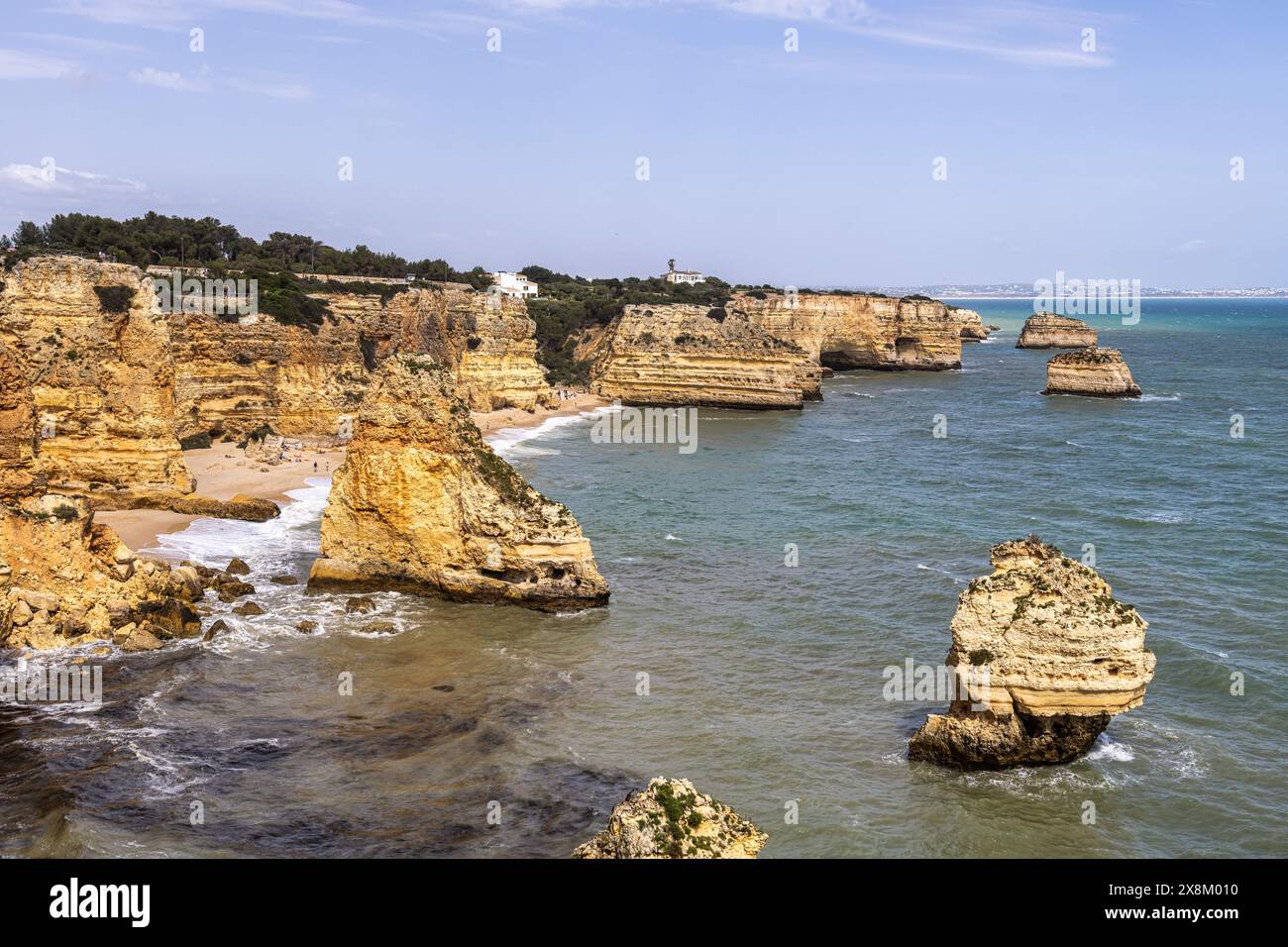 Praia da Marinha Beach among rock islets and cliffs seen from Seven ...