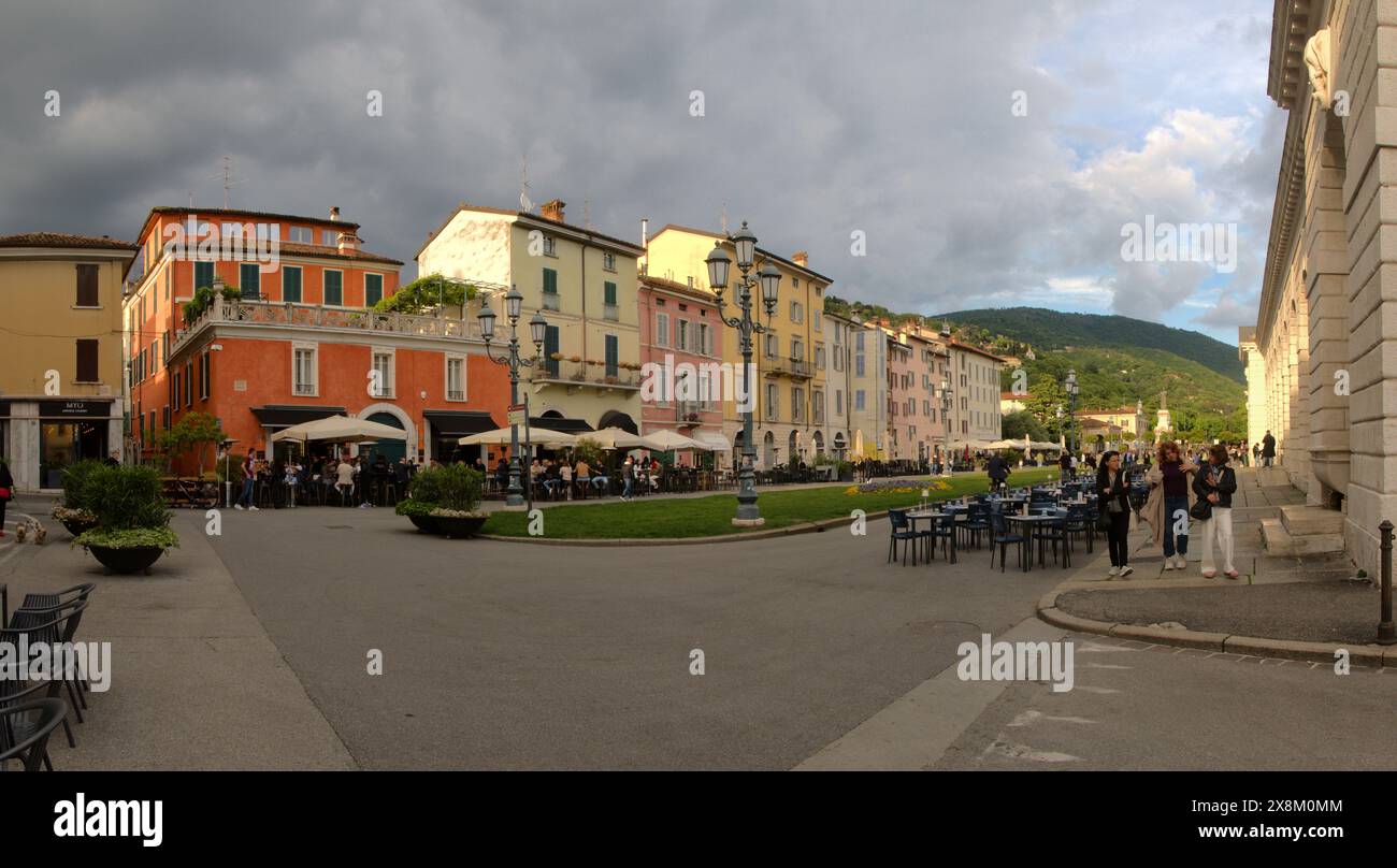 Buildings and restaurant seating on the Piazzale Arnoldo, Brescia in ...