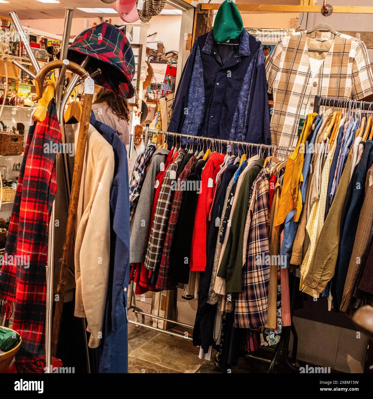 Vintage and retro clothes in a rural antique shop . Colourful ...