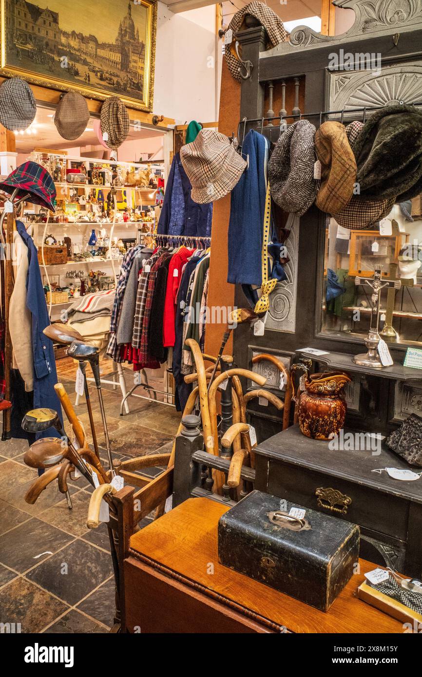 Vintage and retro clothes in a rural antique shop . Colourful ...