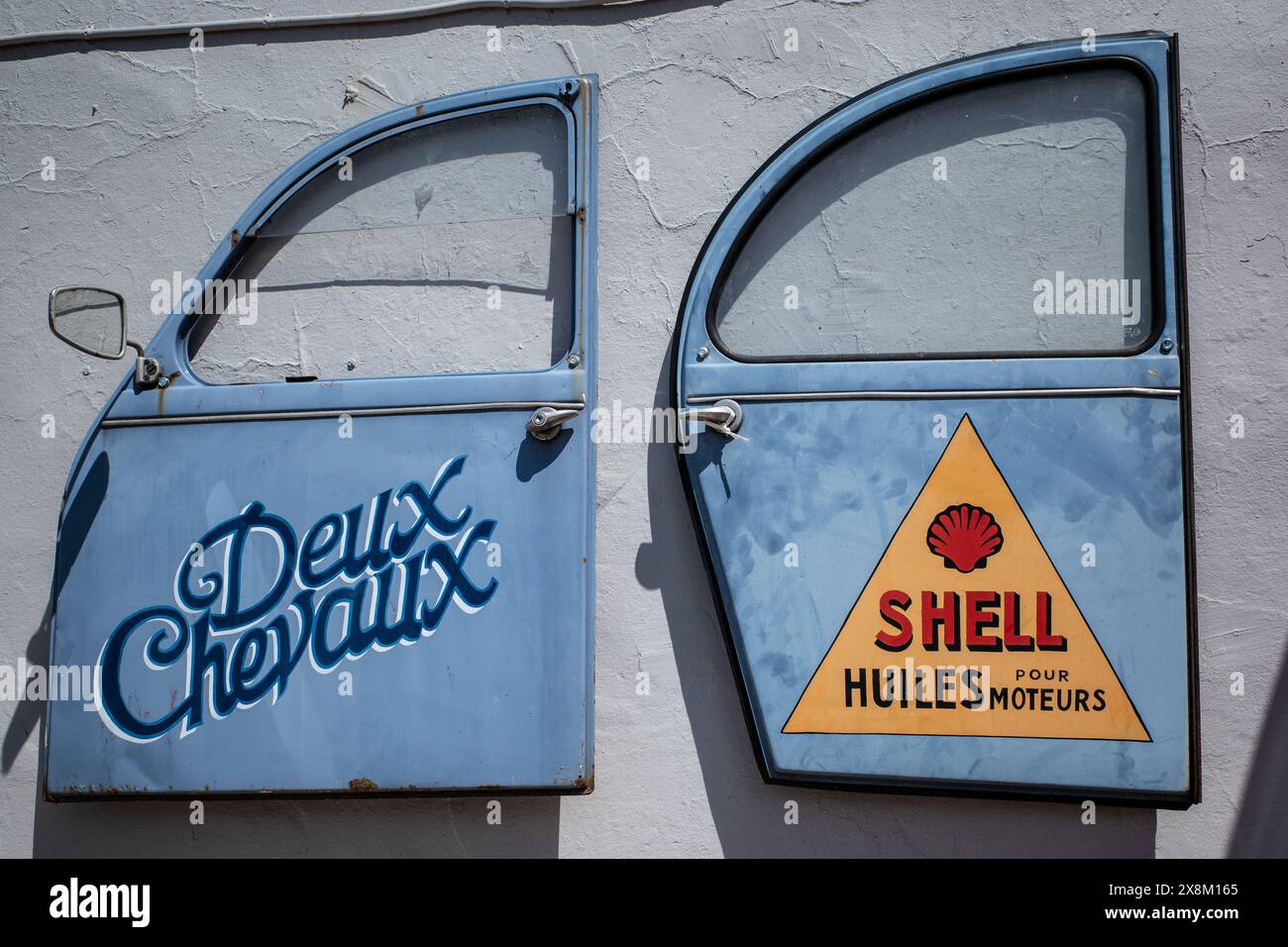 Two vintage car doors from a Citreon 2CV painted light blue with a ...