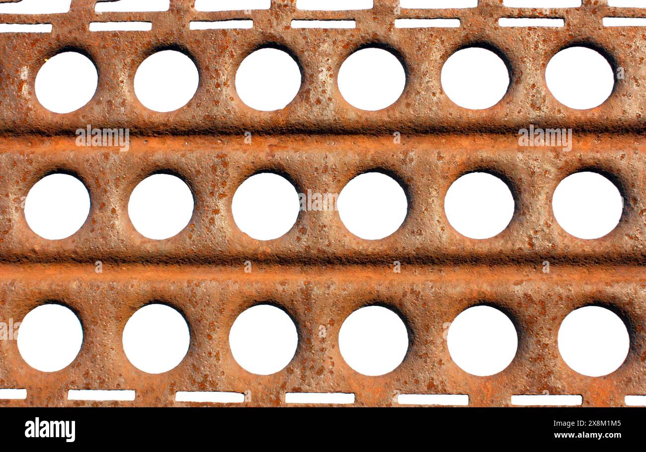Rusty metal plate with cut out holes isolated on white background Stock ...