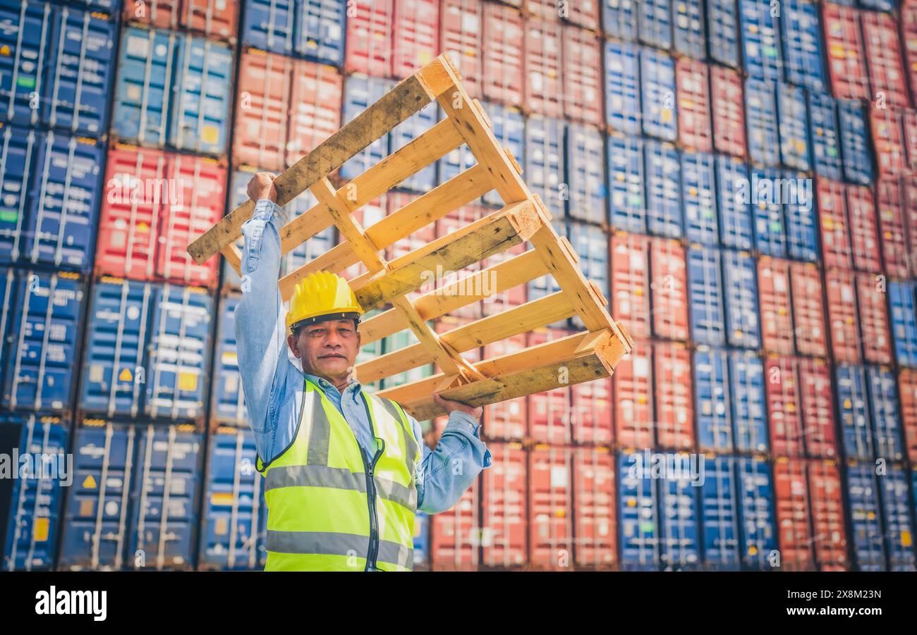 Portrait of Engineer or foreman wears PPE checking container storage ...