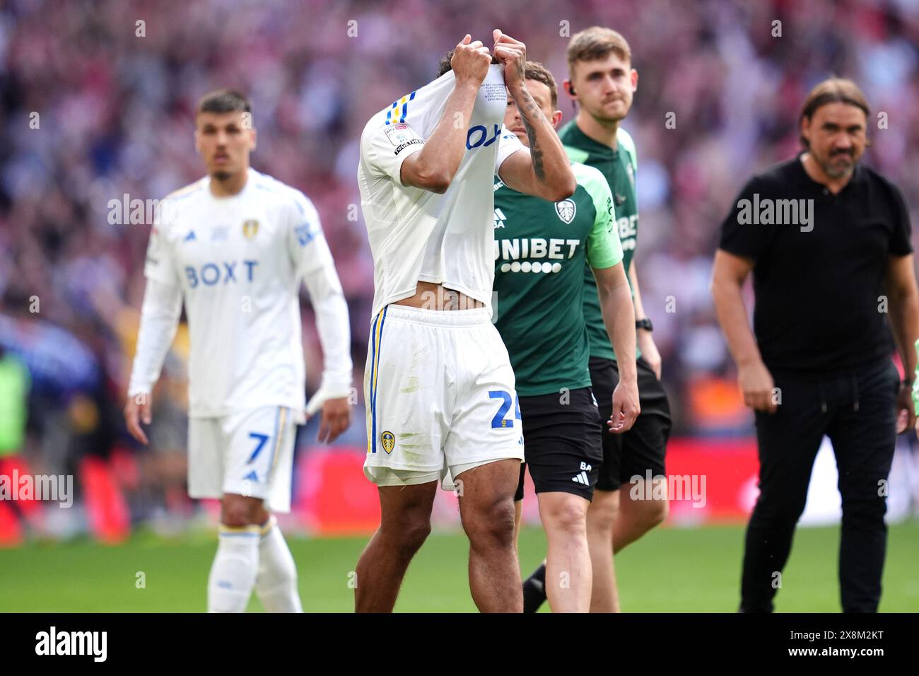 Leeds United's Georginio Rutter (centre) is consoled by team-mates and ...