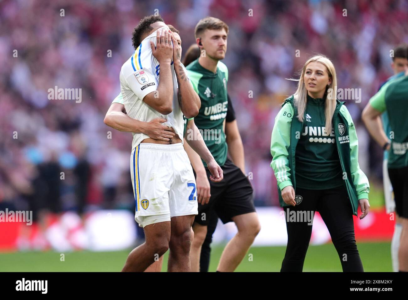Leeds United's Georginio Rutter (left) is consoled by team-mates and ...