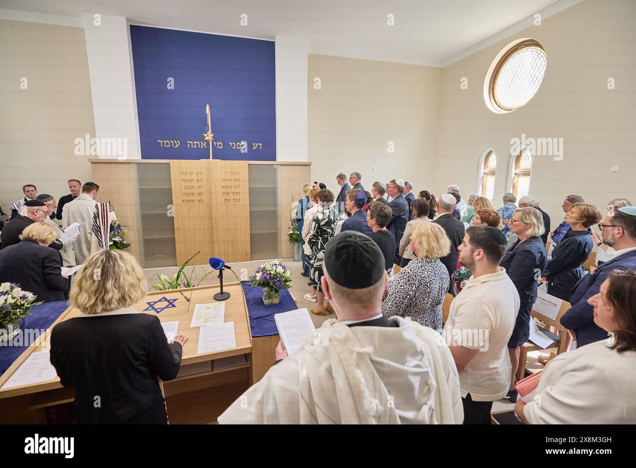 Kiel, Germany. 26th May, 2024. Guests pray during the inauguration of ...