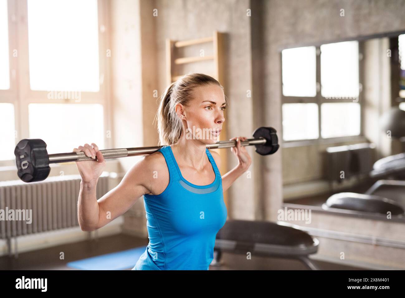 Woman lifting barbell off hi-res stock photography and images - Alamy