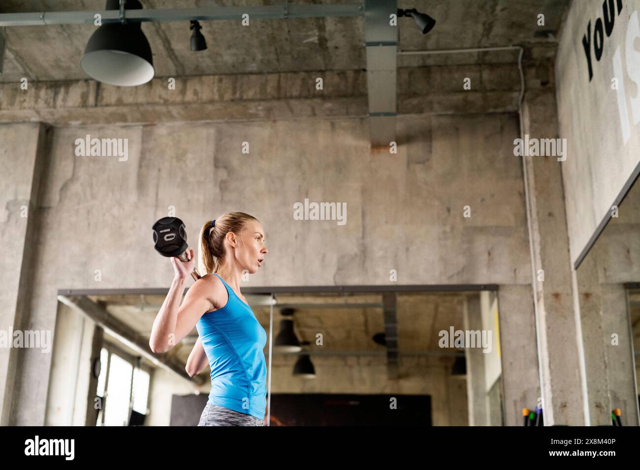 Woman lifting barbell off hi-res stock photography and images - Alamy