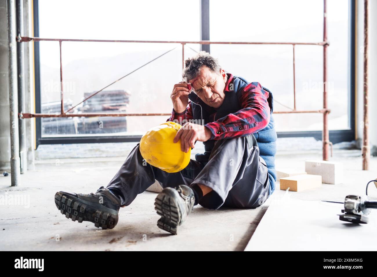 Injured worker with wound on head, head injury. Work injury, accident ...