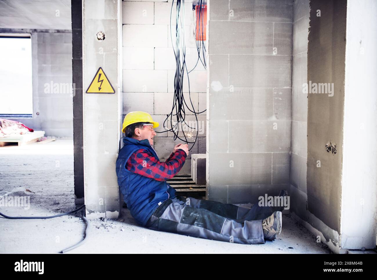 Electrocution hazard. Worker is injured on job site, electrical ...