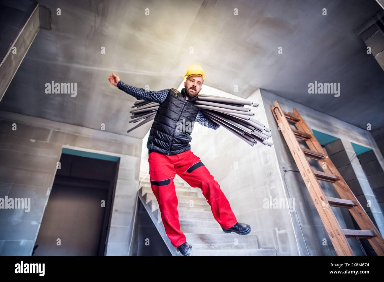 Man falling off the ladder. Accident of a man worker at the ...