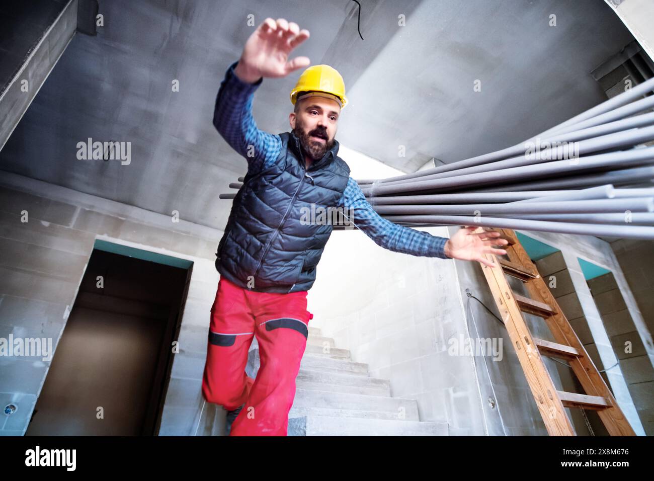 Man falling off the ladder. Accident of a man worker at the ...