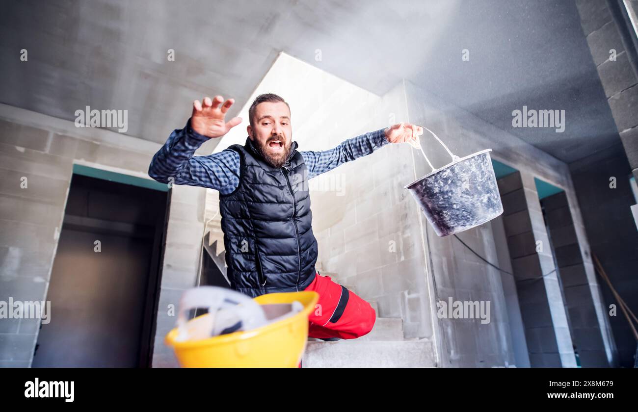 Man falling down the stairs. Accident of a man worker at the ...