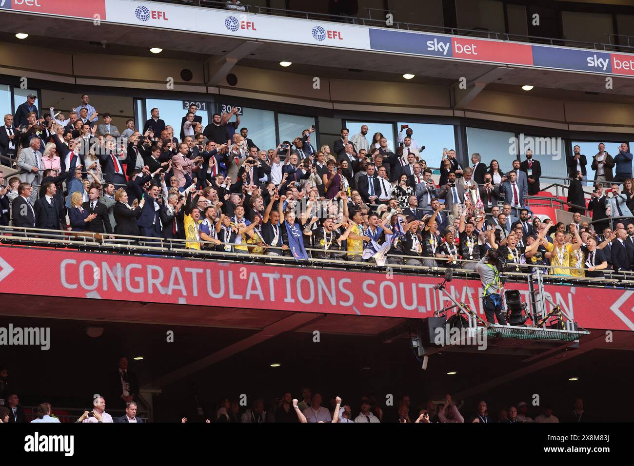 London, UK. 26th May, 2024. Southampton players celebrate as they lift ...