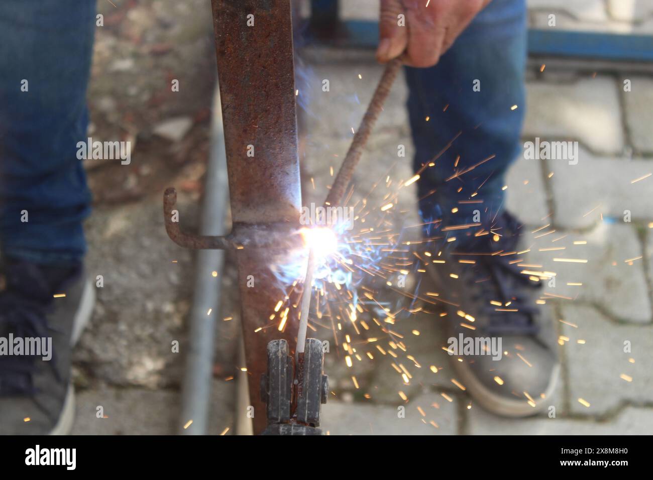 Welding man working on iron welding in construction site. Close up ...