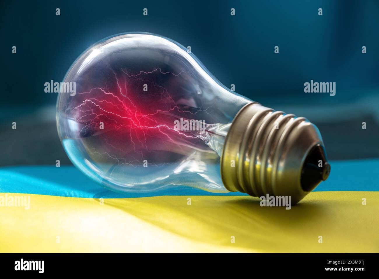 Incandescent lamp and lightning in the lamp lies on the flags of ...