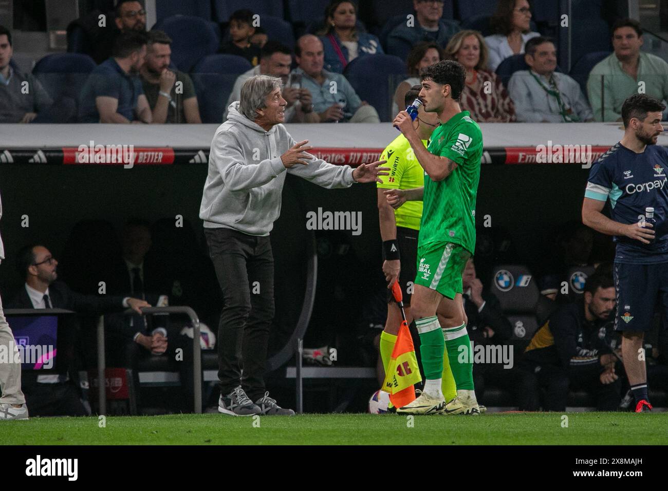 Manuel Pellegrini (L), coach of Betis gives instructions during a ...
