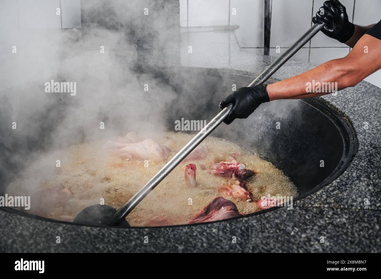 Male hand stirring pilaf in hi-res stock photography and images - Alamy