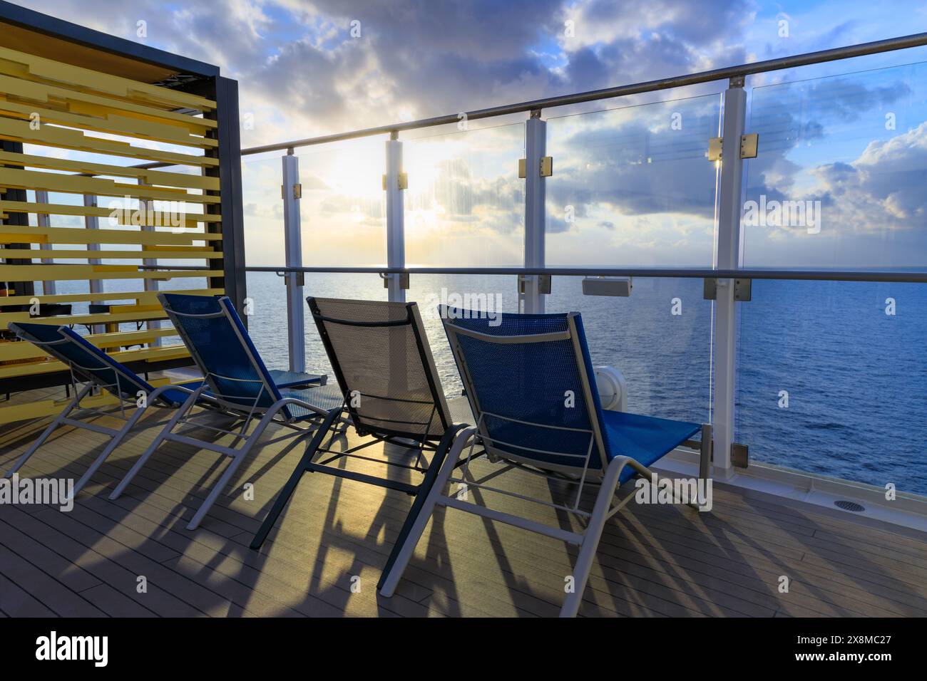 Relaxation on the cruise ship: cloudscape crossed by rays of sun seen ...