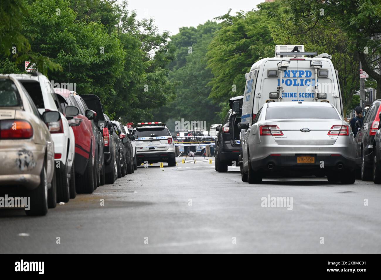 Crime scene unit staged evidence markers on the ground highlighting ...