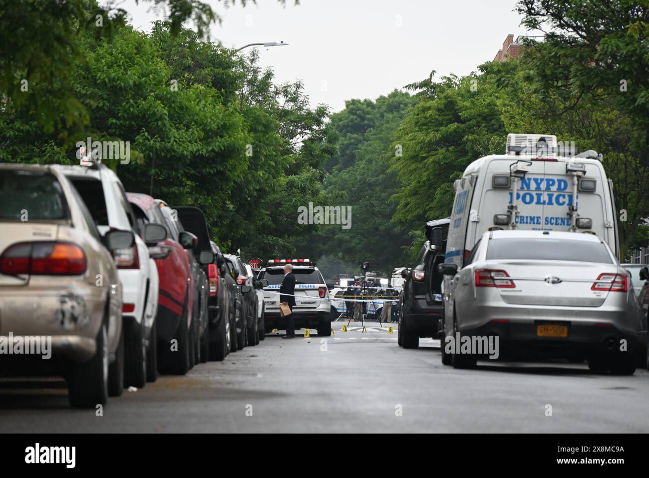 Crime scene unit staged evidence markers on the ground highlighting ...