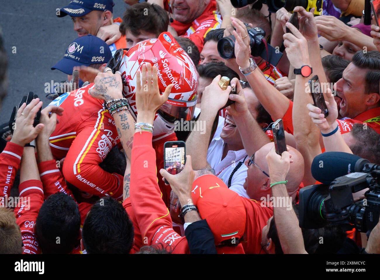 Charles Leclerc of Monaco and Ferrari celebrates his win on the grid ...