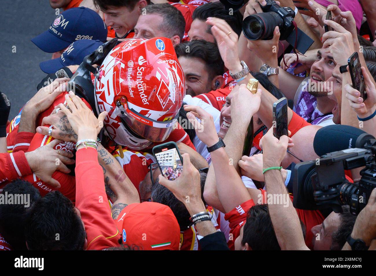 Charles Leclerc of Monaco and Ferrari celebrates his win on the grid ...