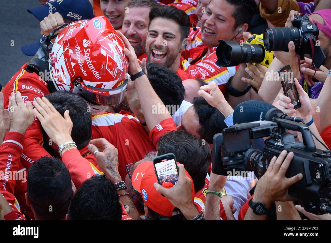 Charles Leclerc of Monaco and Ferrari celebrates his win on the grid ...