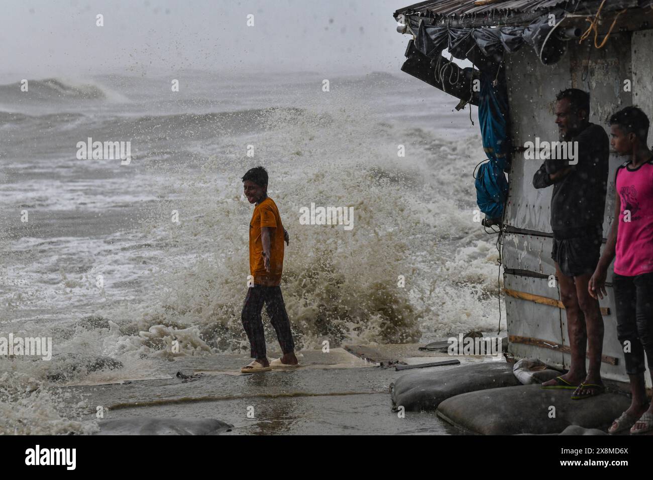 Dhaka, Bangladesh. 26th May, 2024. A Boy are gather on an embankment in ...