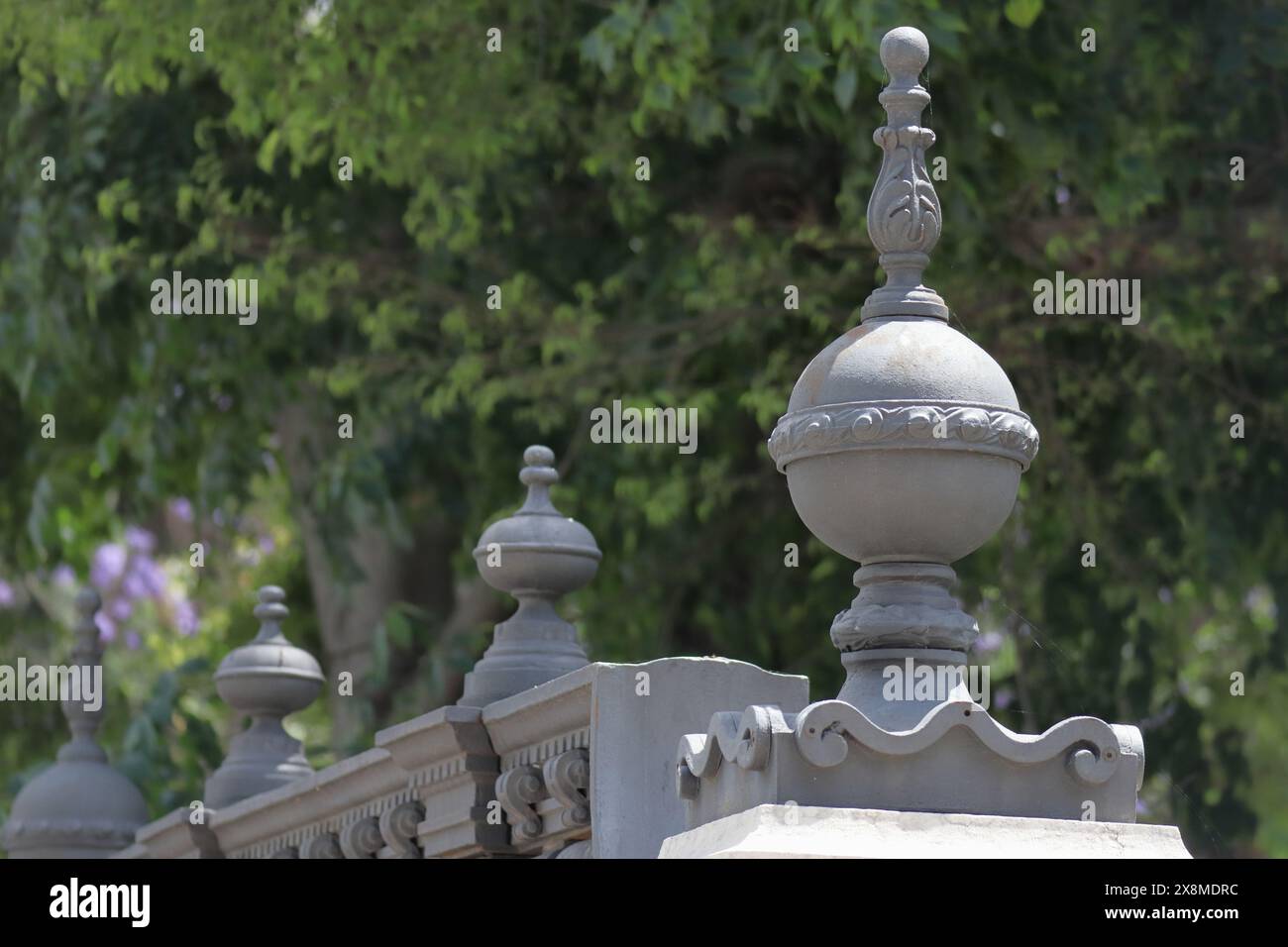 Ornaments topping wall columns in Seville Stock Photo - Alamy