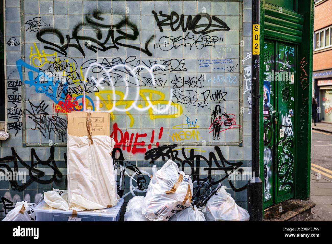 Manchester UK 26 March 2024. City wall covered in colourful graffiti ...