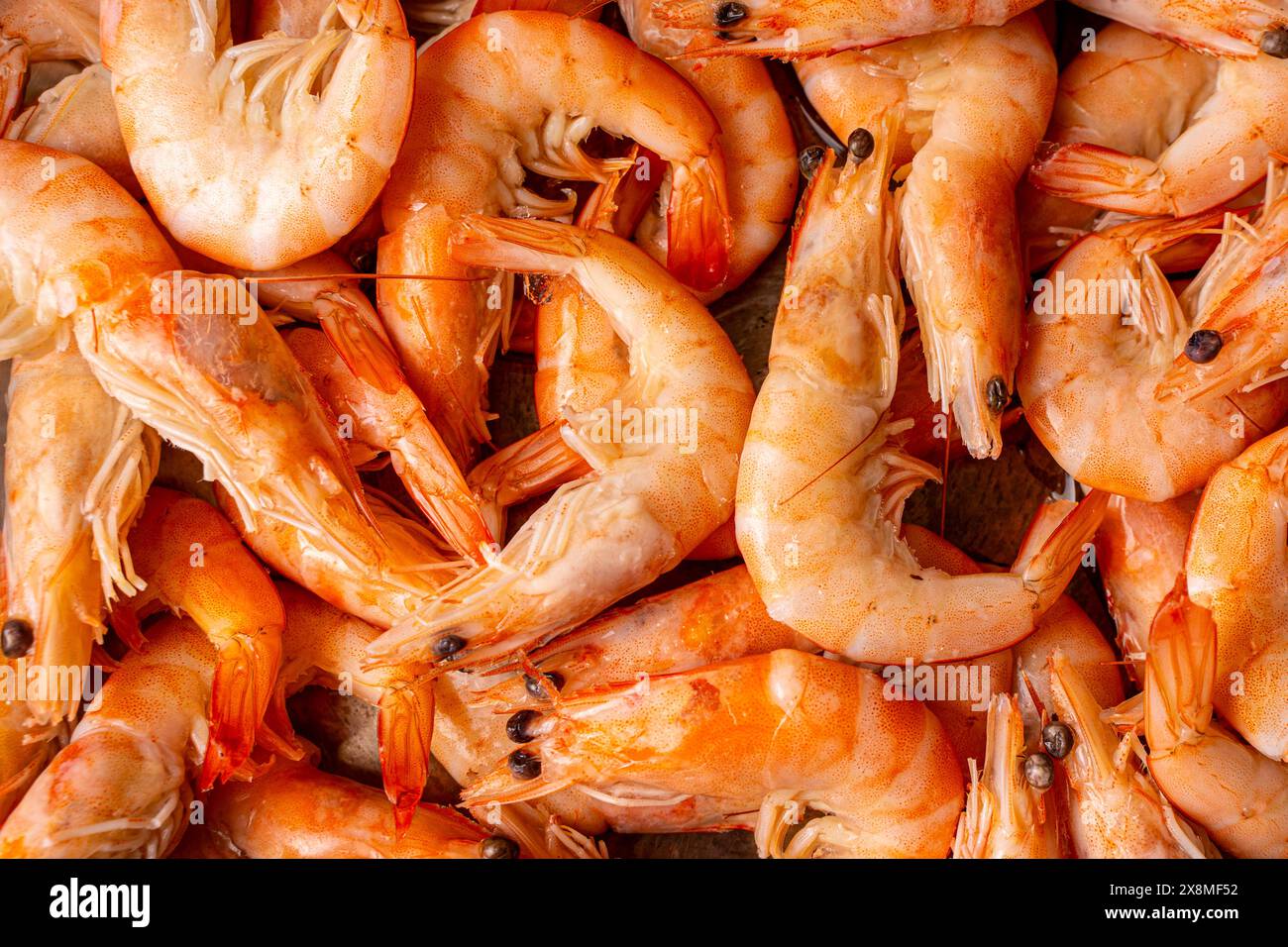 Frozen, boiled shrimp. Texture King prawns background. Seafood on the ...
