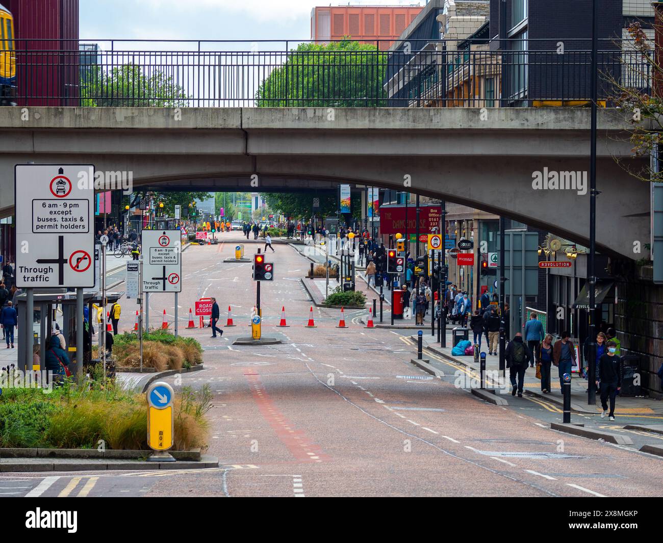 Manchester UK 26 May 2024. Oxford road Urban street scene: people walking, traffic signs under ...