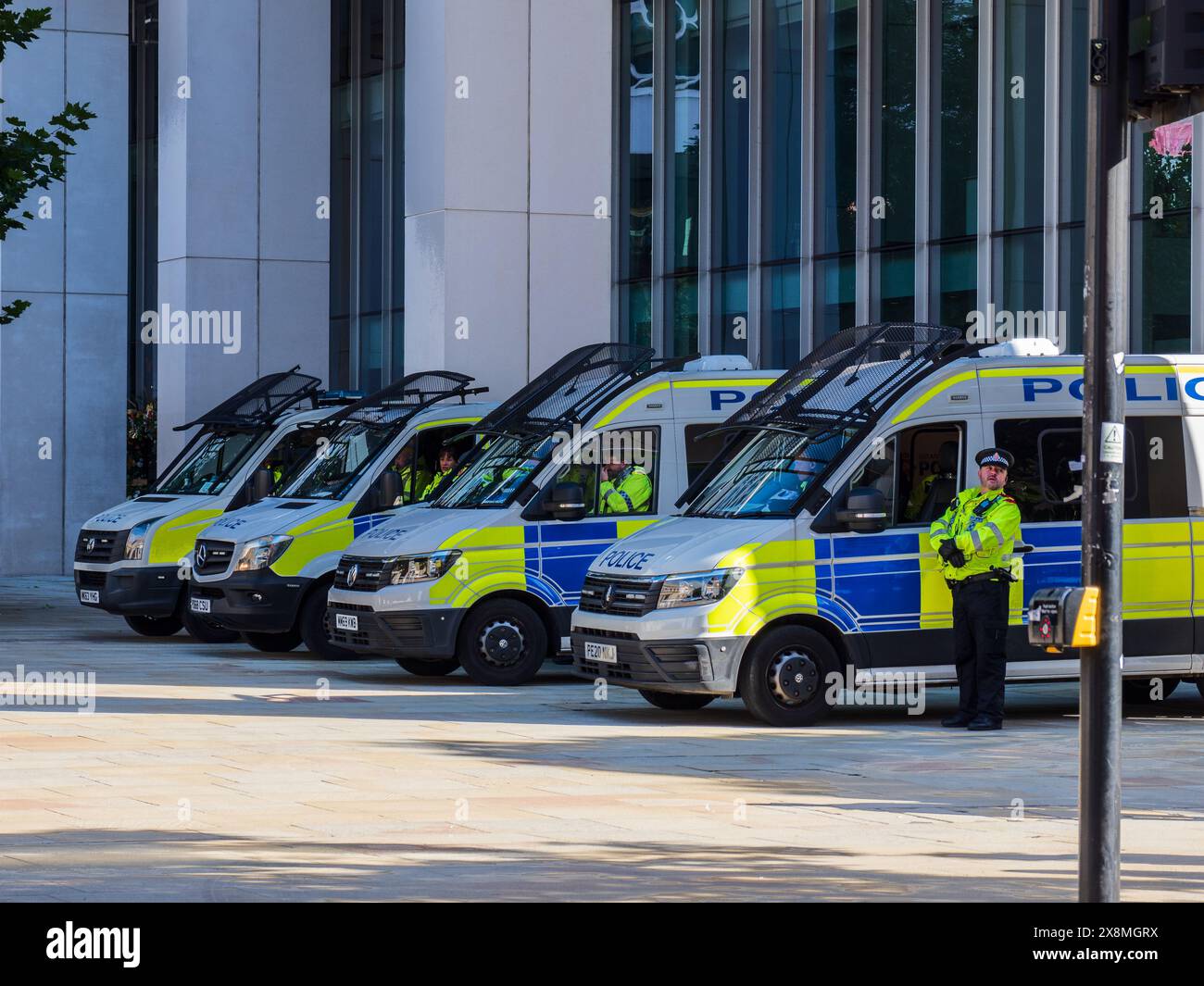 Manchester UK 26 May 2024. Police vans parked outside building with ...