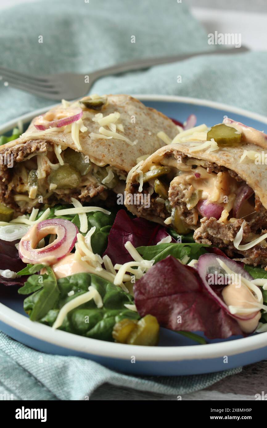 Cheeseburger Wrap with Beef Patty, Pickles, Cheese, and Lettuce Stock ...