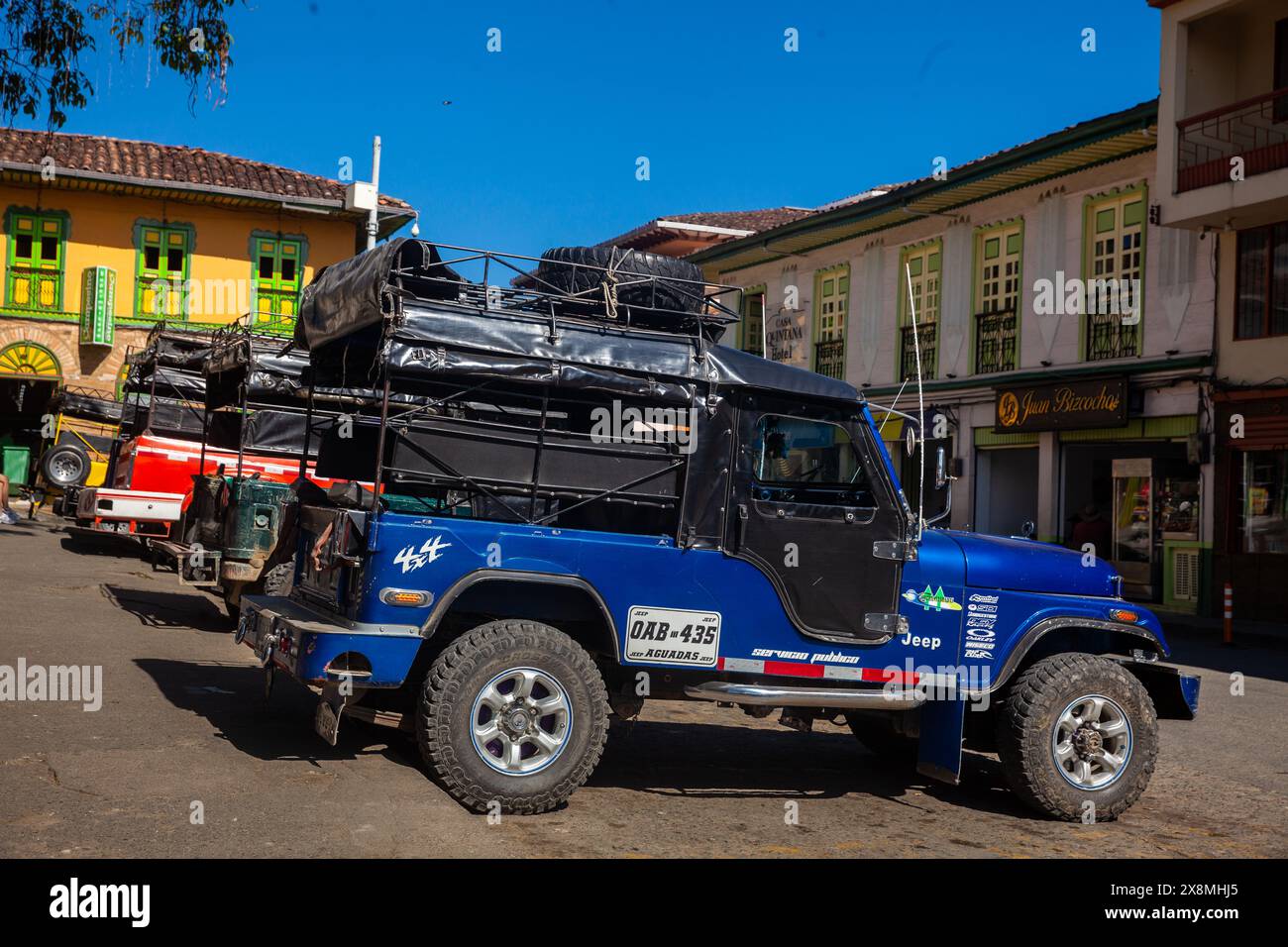 Colorful traditional vehicles at the central square of the historical ...