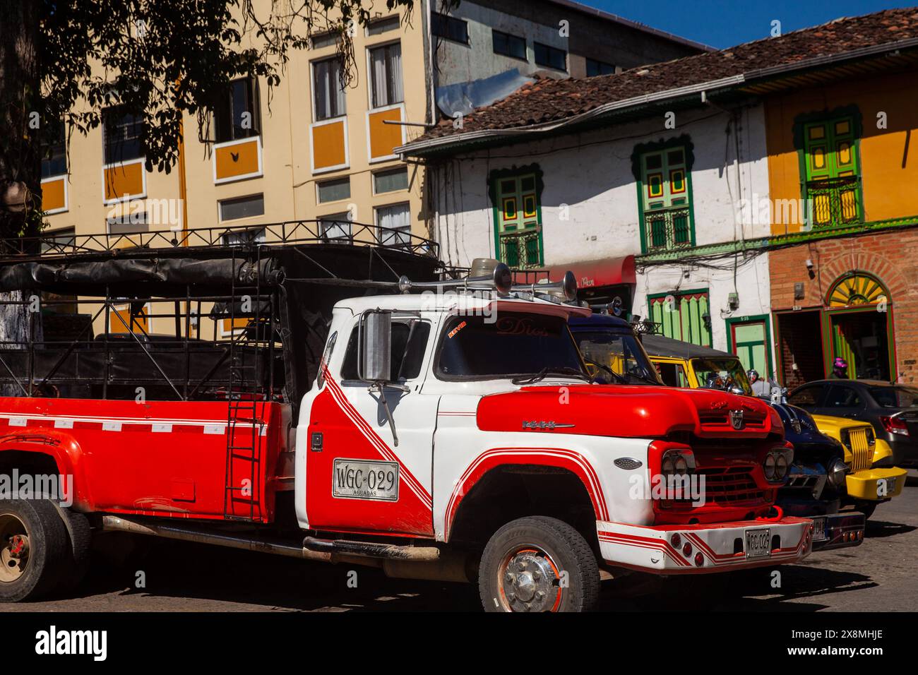 Colorful traditional vehicles at the central square of the historical ...