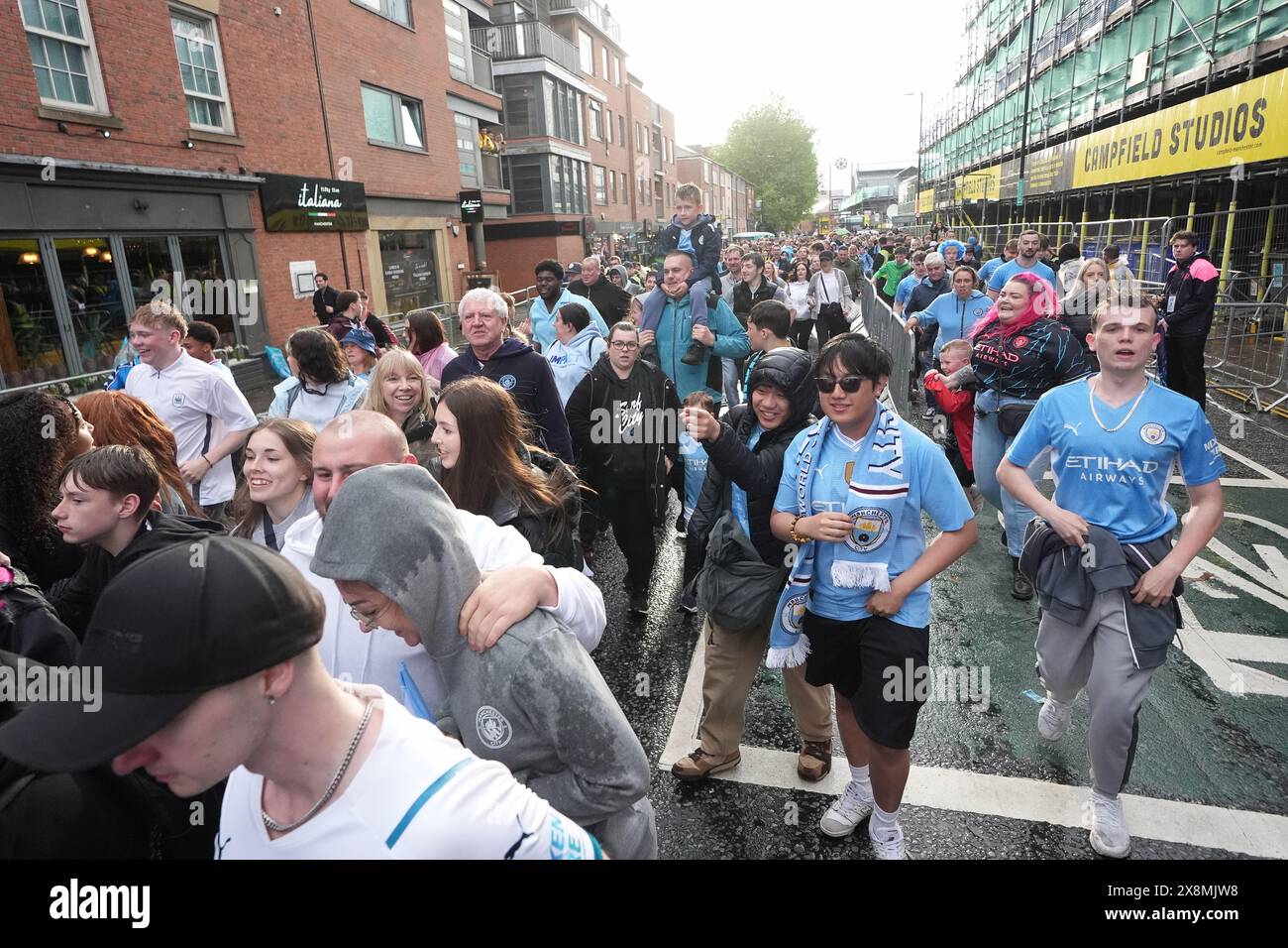 Manchester City fans during a trophy parade in Manchester, after they ...