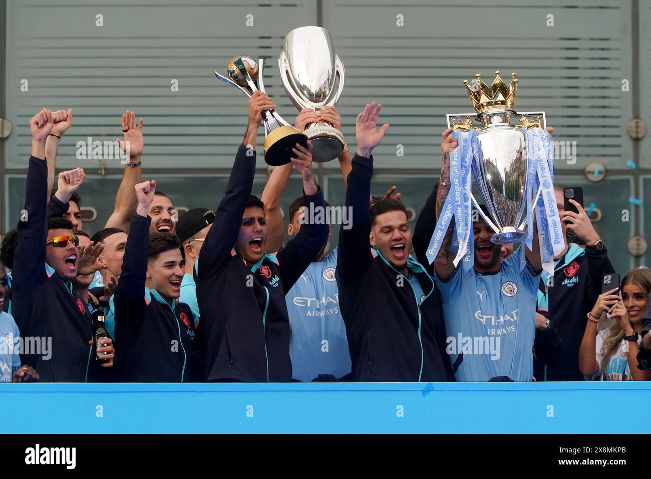 Manchester City's Kyle Walker and team-mates celebrate with the Premier ...