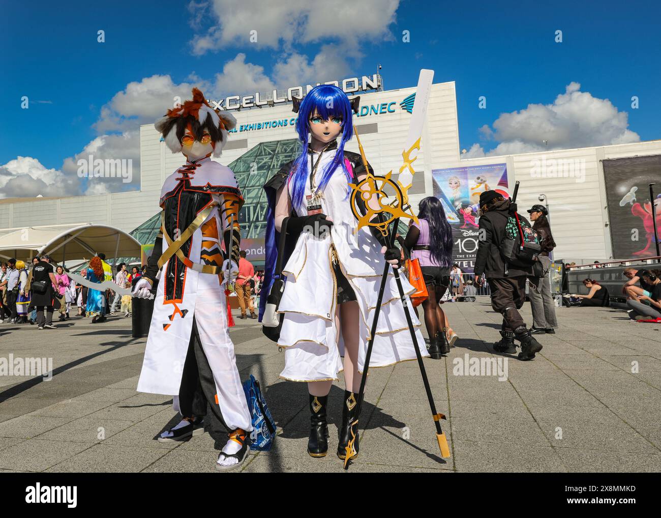 London, UK. 26th May, 2024. Two cosplayers in outfits from the 'Fate ...