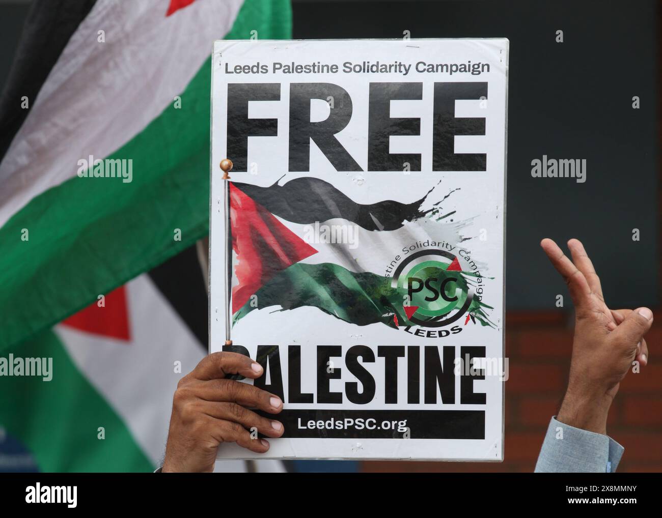 Doncaster, England, UK. 26th May, 2024. A protester holds a sign saying ...